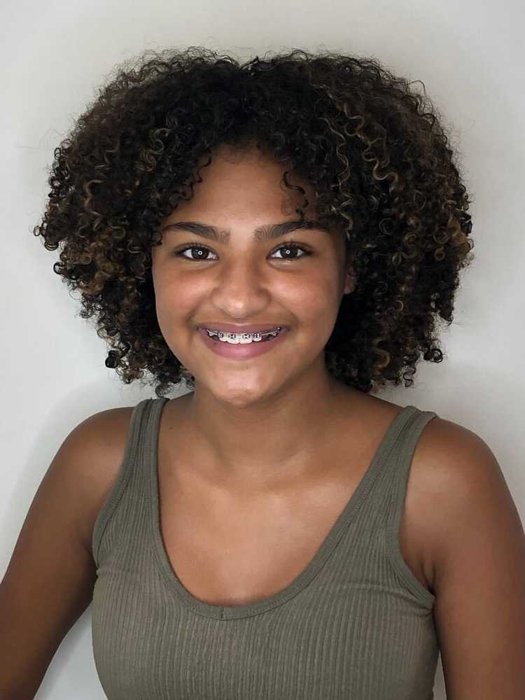 13 Tips For Taming Frizz In Curly Hair